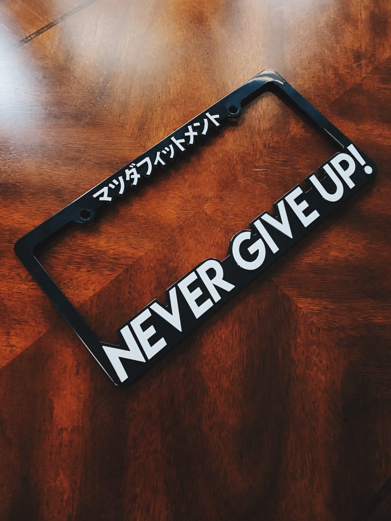 NEVER GIVE UP! LICENSE PLATE FRAMES – Mazda Fitment